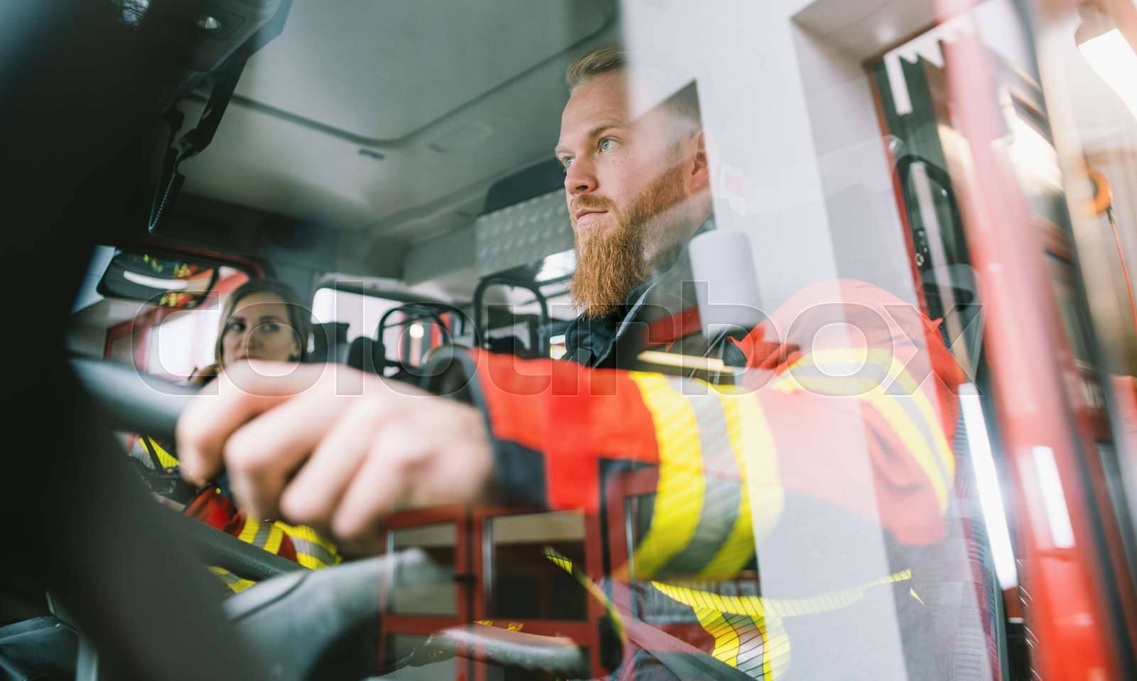 Driver of a fire truck in action | Stock image | Colourbox