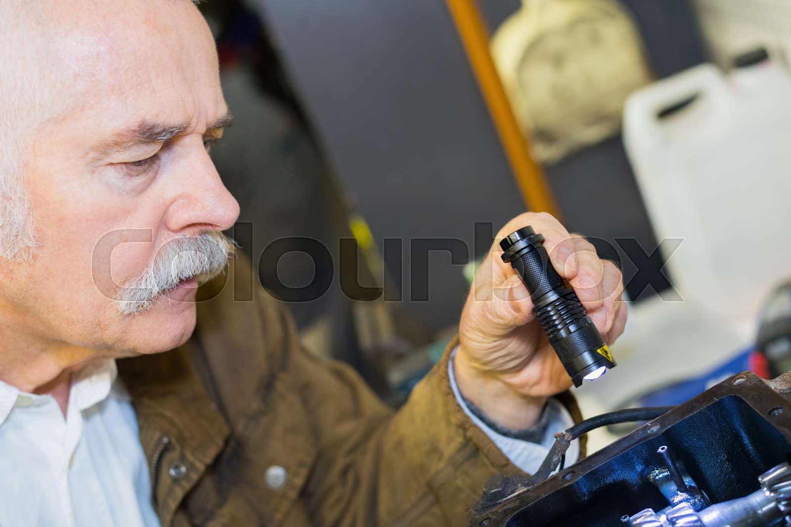 senior checking something | Stock image | Colourbox