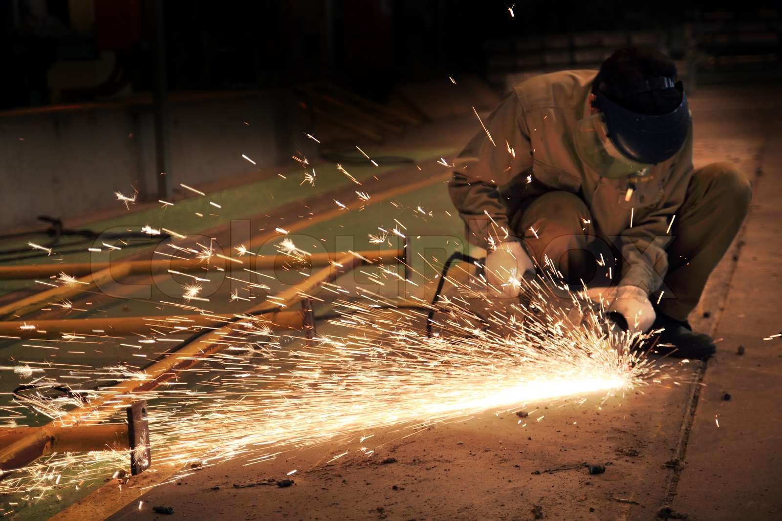 ndustrial worker make spark ,Cutting machine | Stock image | Colourbox