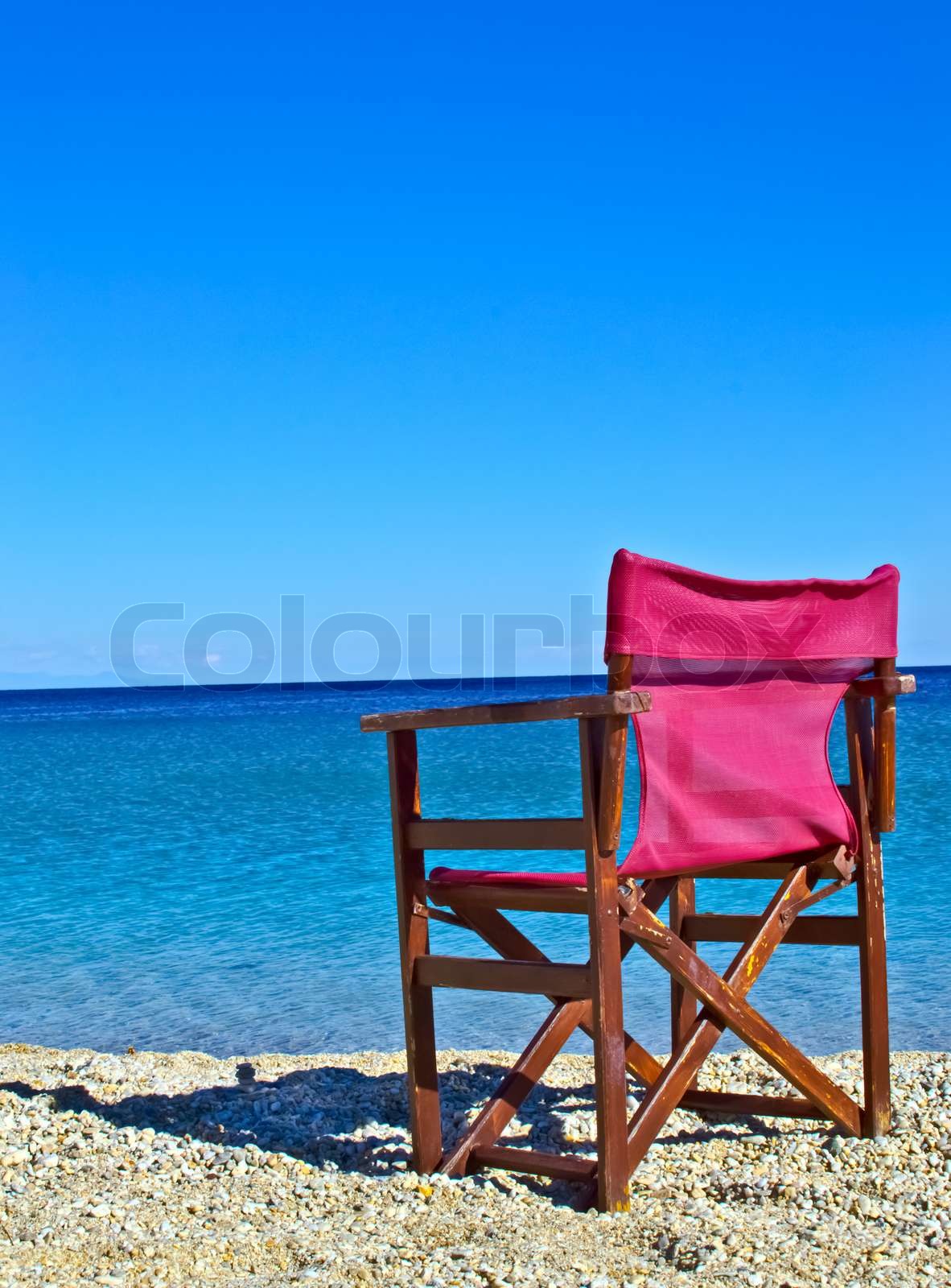 beach chair on shore near sea | Stock image | Colourbox