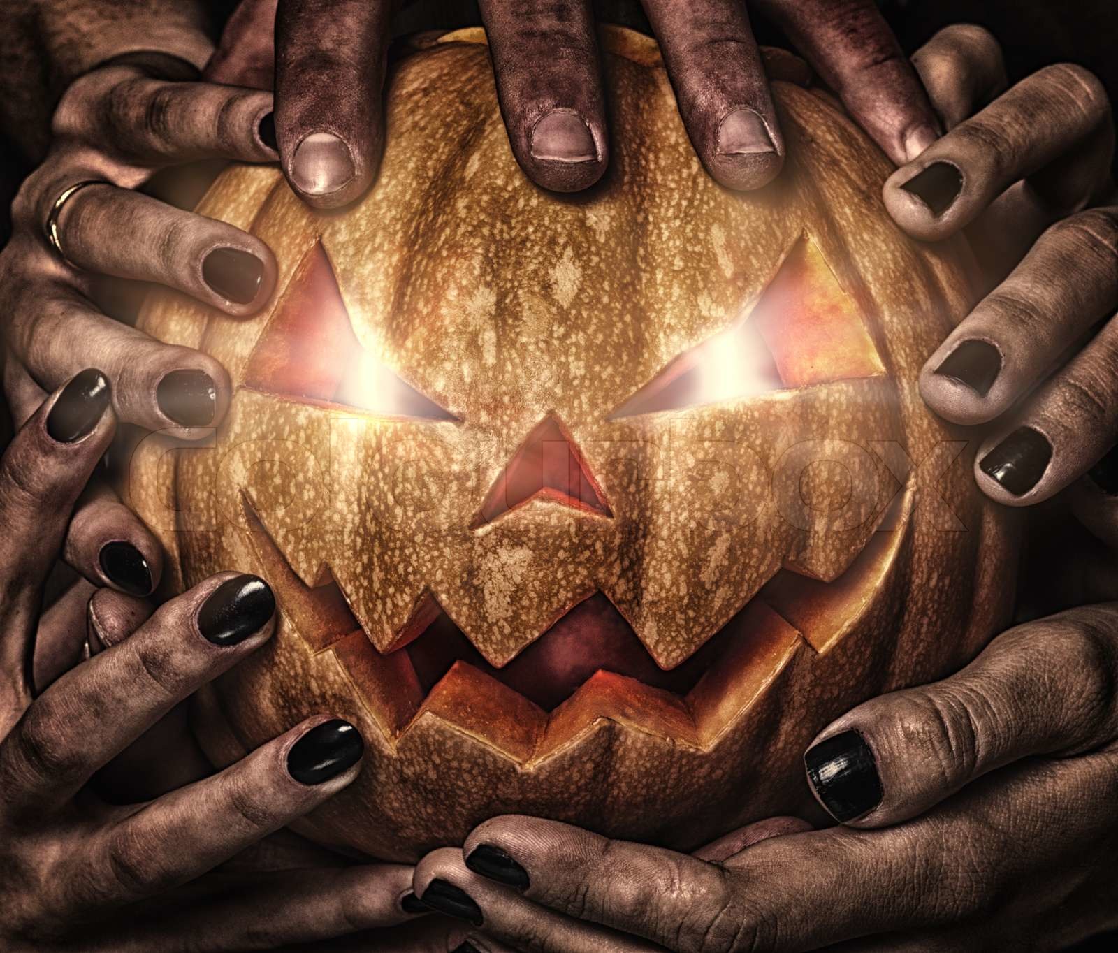 evil pumpkin with glowing eyes that are holding | Stock image | Colourbox