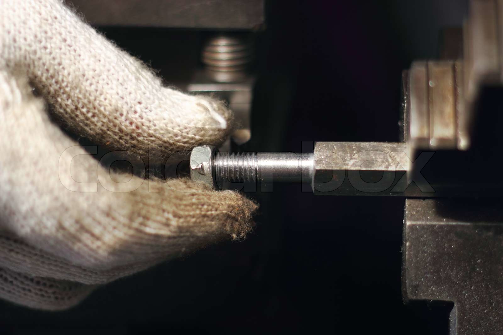 Industrial worker make a stud and bolt by lathe machine | Stock image ...
