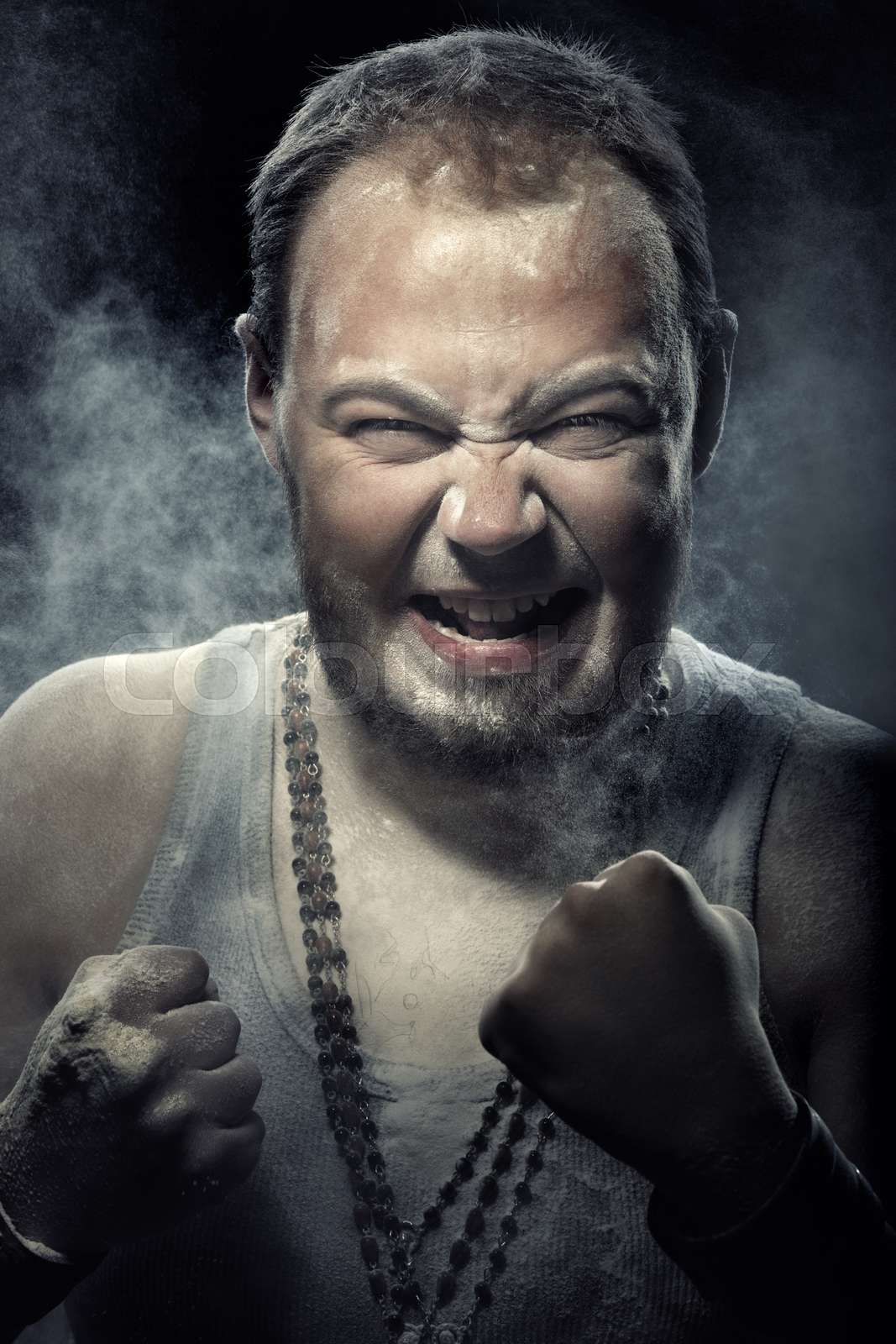 Brutal angry man covered by the dust | Stock image | Colourbox