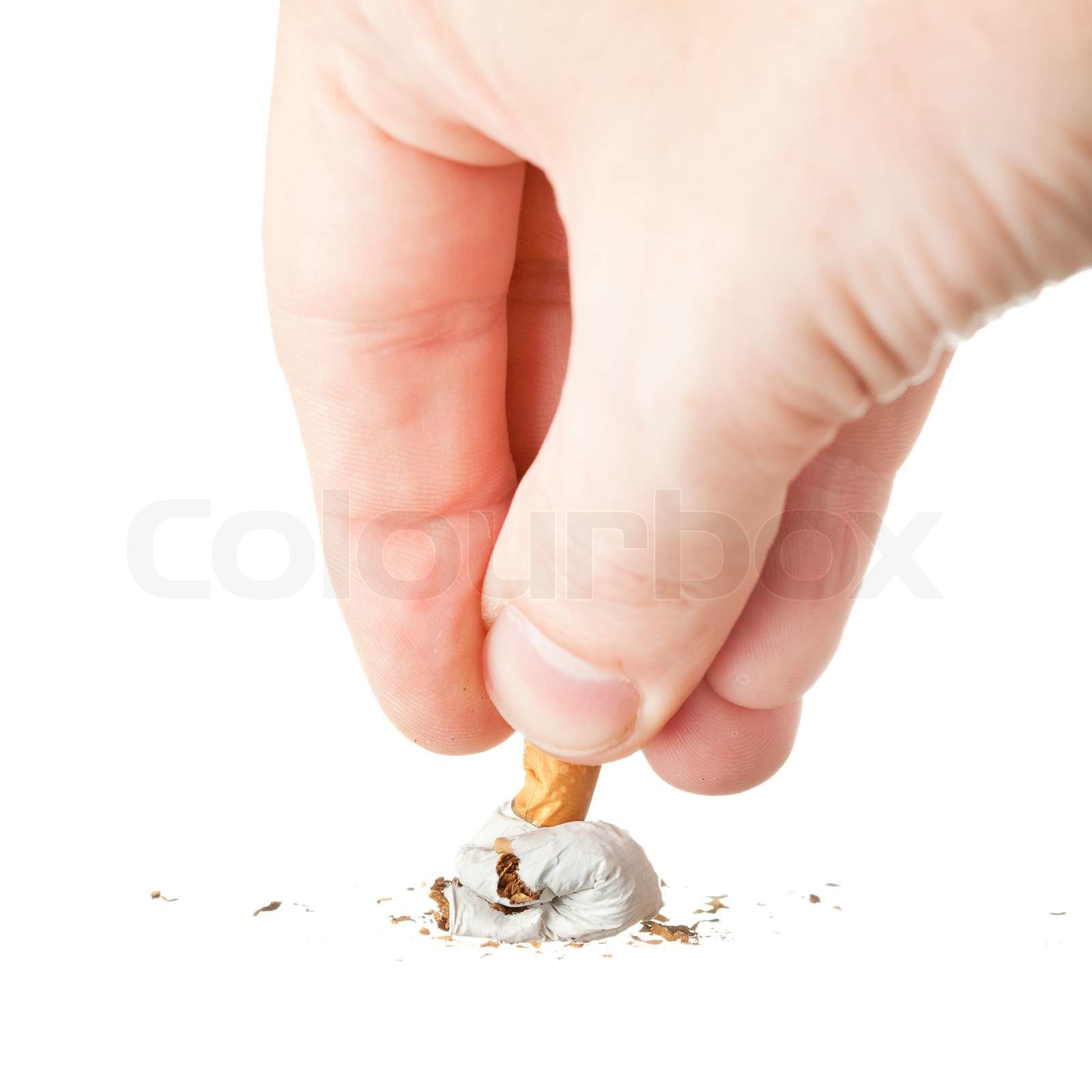 hand extinguishing a cigarette on white | Stock image | Colourbox