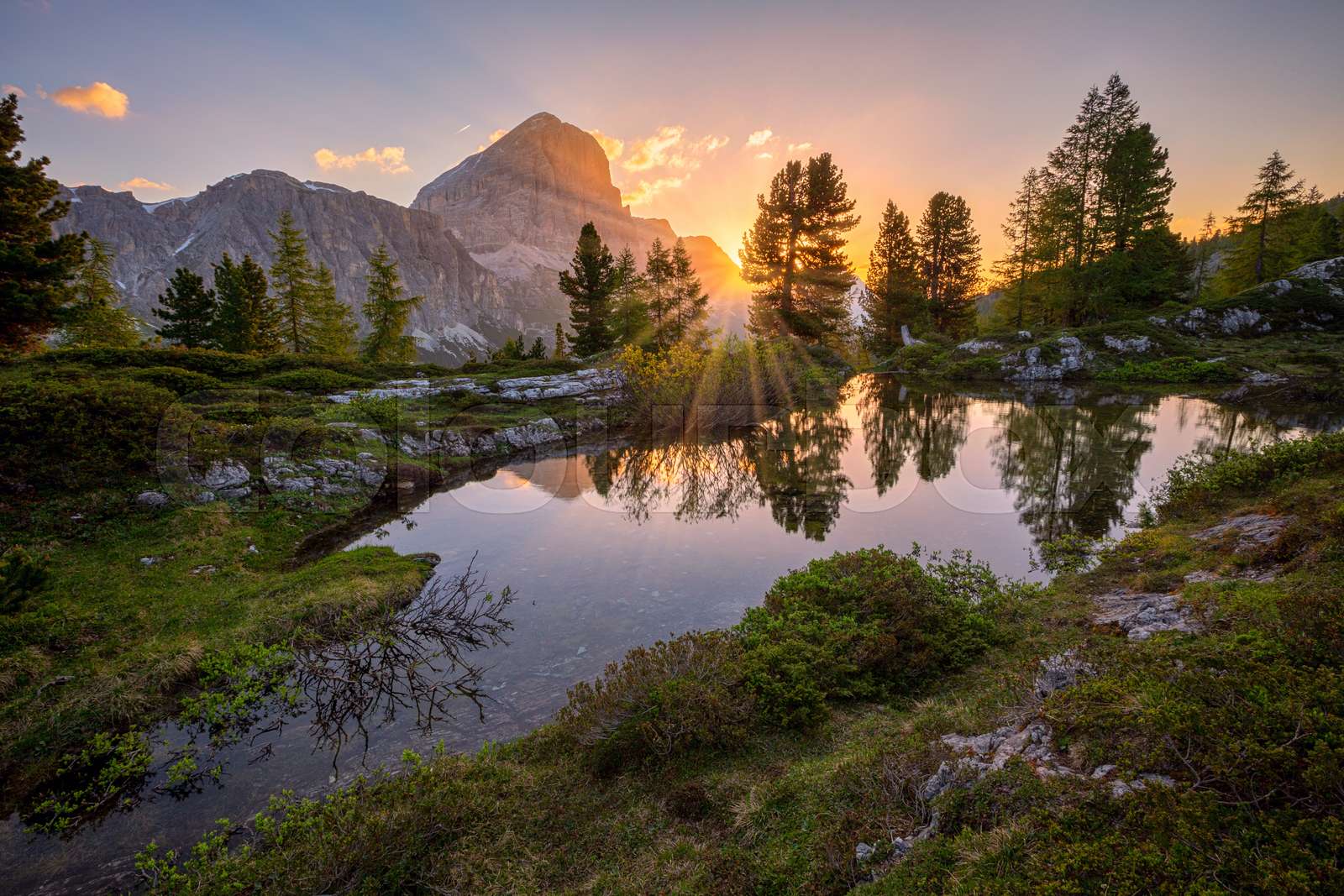 sunrise over pond close to Lago di Limides, Dolomites, Italy | Stock ...