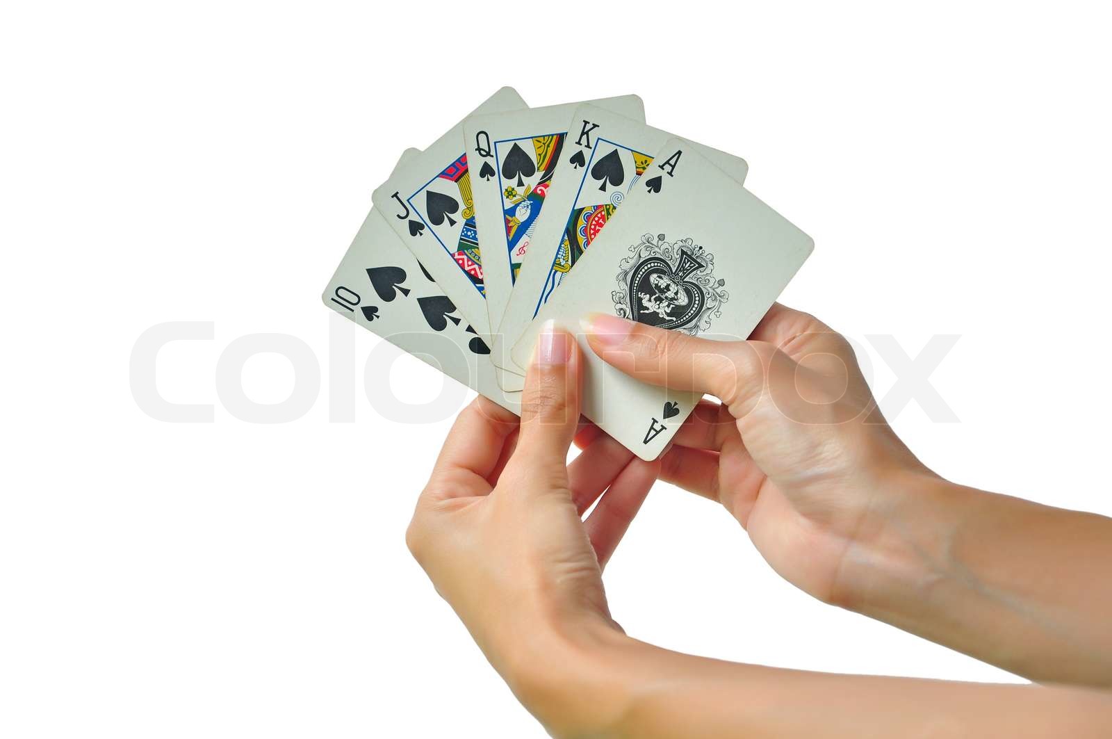 Playing cards in hand | Stock image | Colourbox