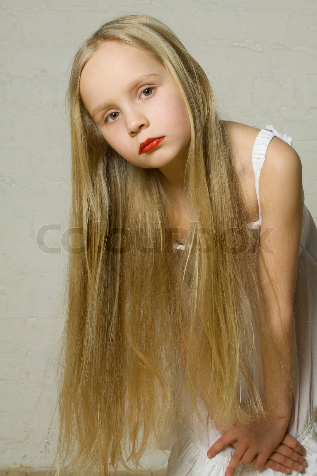 Young girl fashion model with long blond hair | Stock image | Colourbox