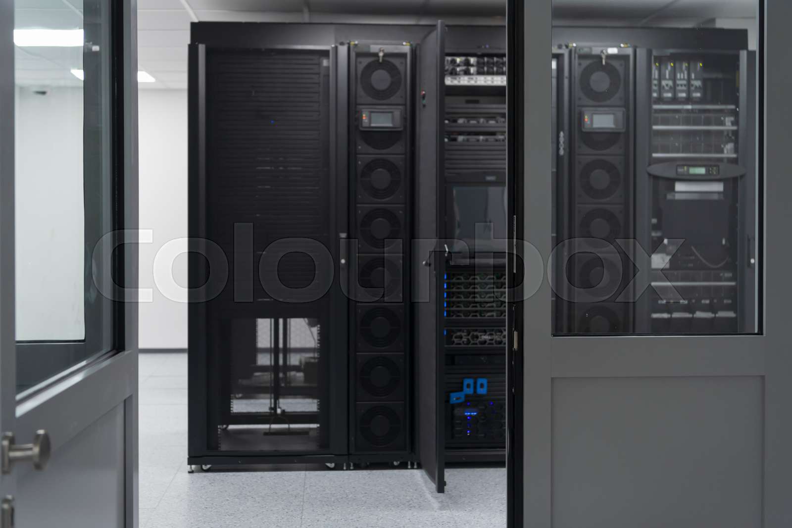 Data Center With Multiple Rows of Fully Operational Server Racks. Modern Telecommunications ...