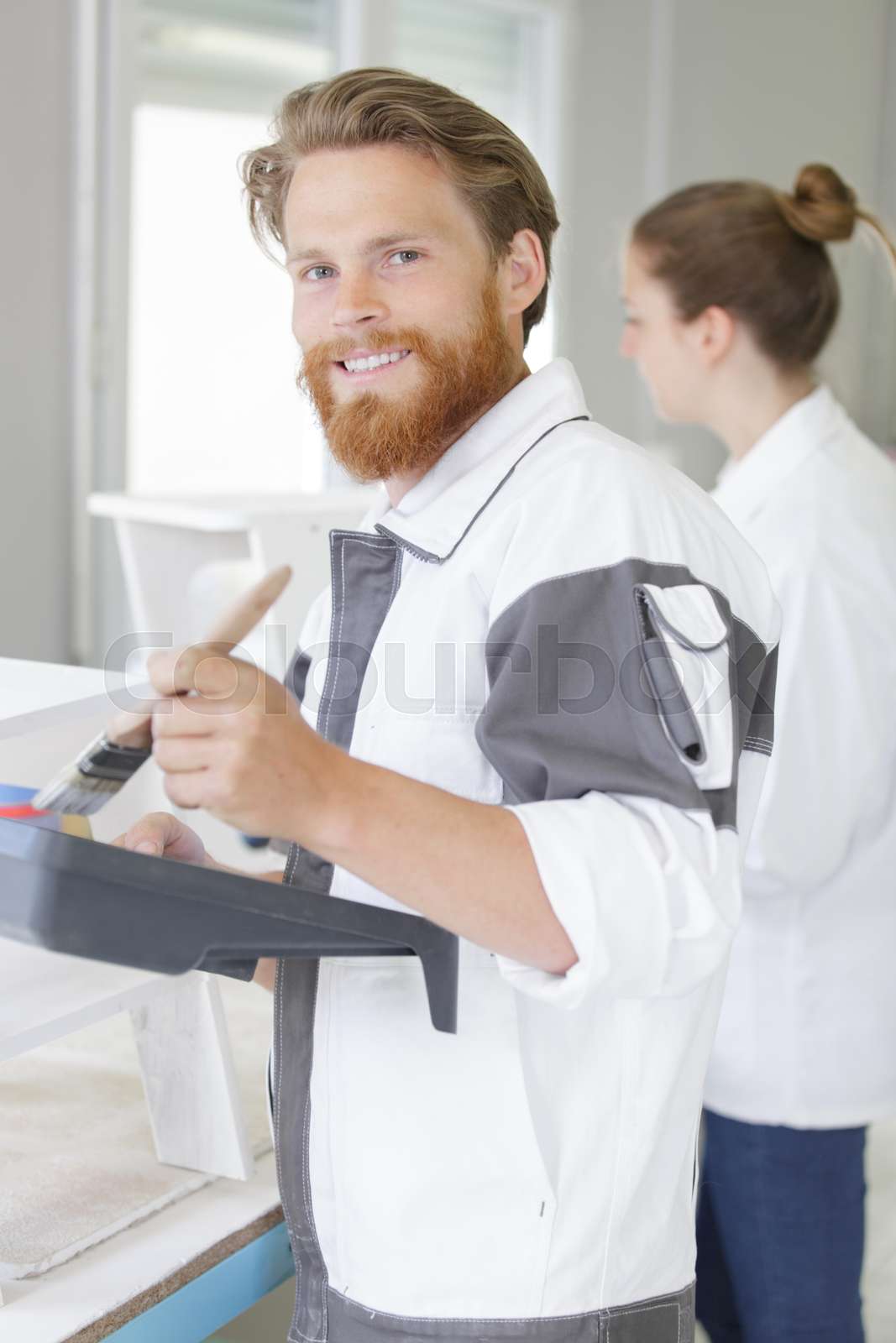 painter men mixing paint at work | Stock image | Colourbox