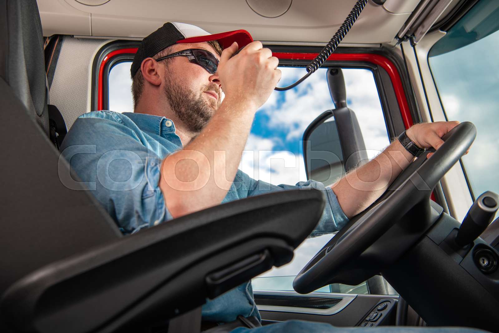 Semi Truck Lorry Driver Talking on CB Radio | Stock image | Colourbox