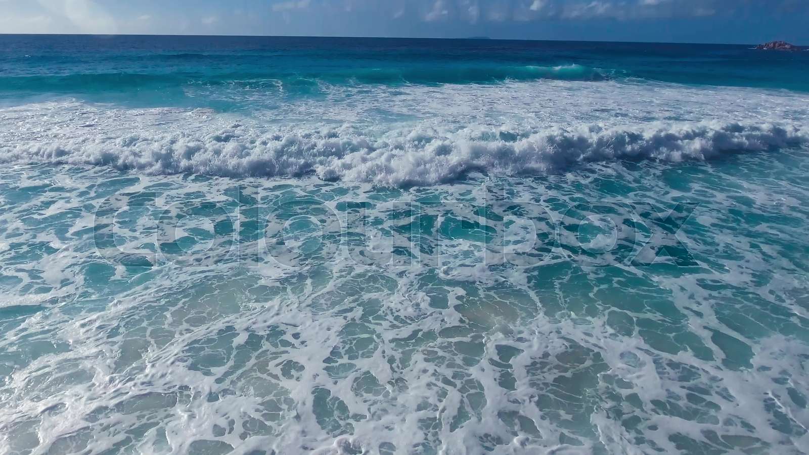 Amazing overhead aerial view of island shoreline with waves along the ...