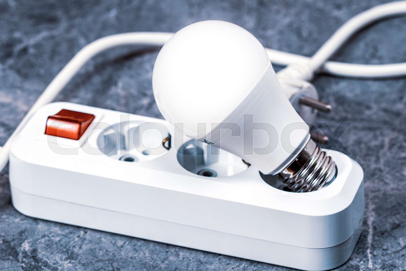 Electrical extension cord and light bulb | Stock image | Colourbox