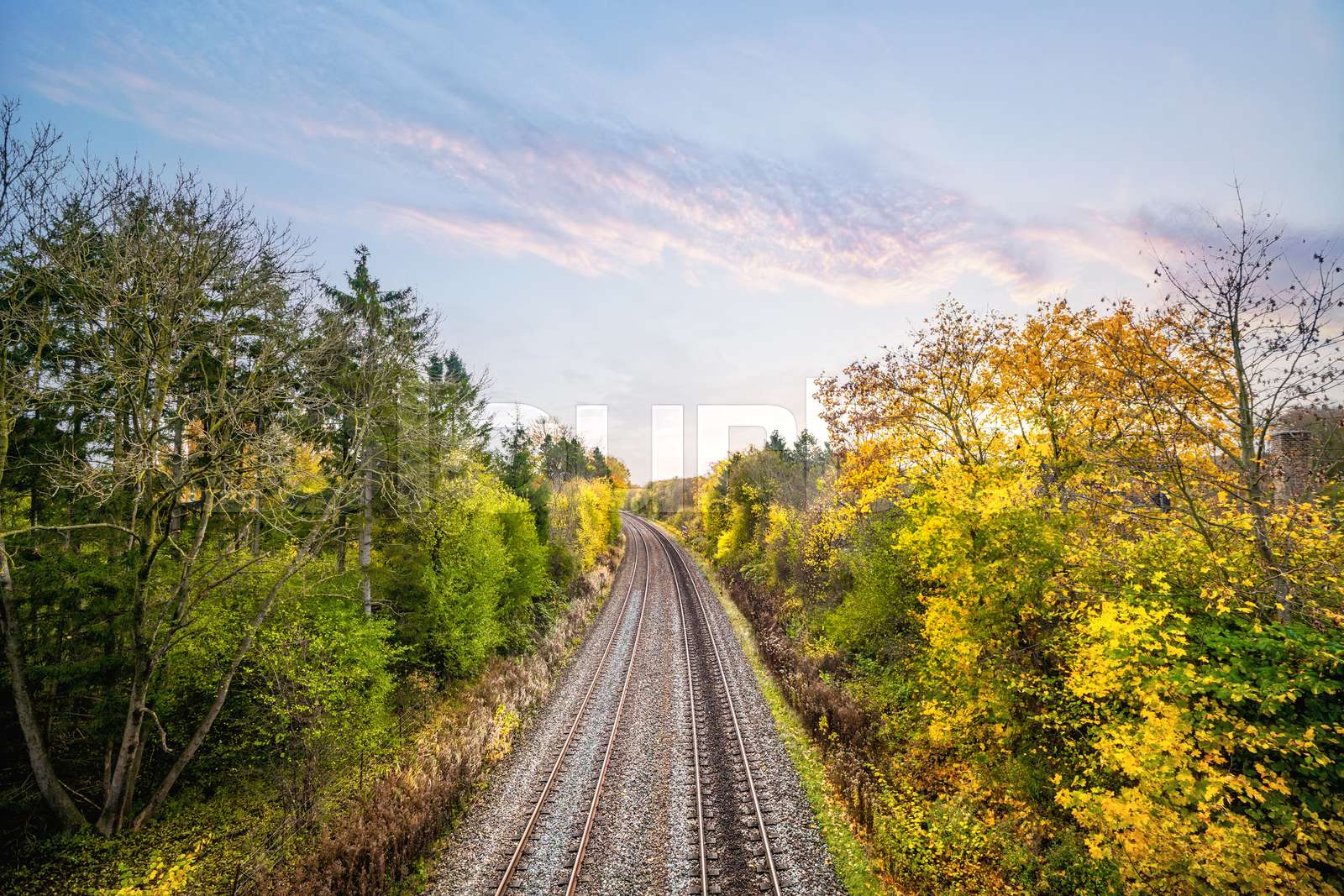Colorful autumn scenery with a railroad track | Stock image | Colourbox