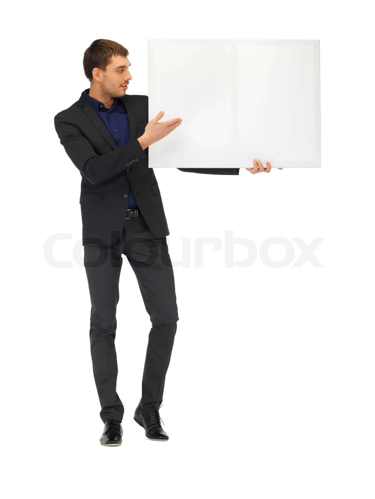handsome man in suit with a blank board | Stock image | Colourbox