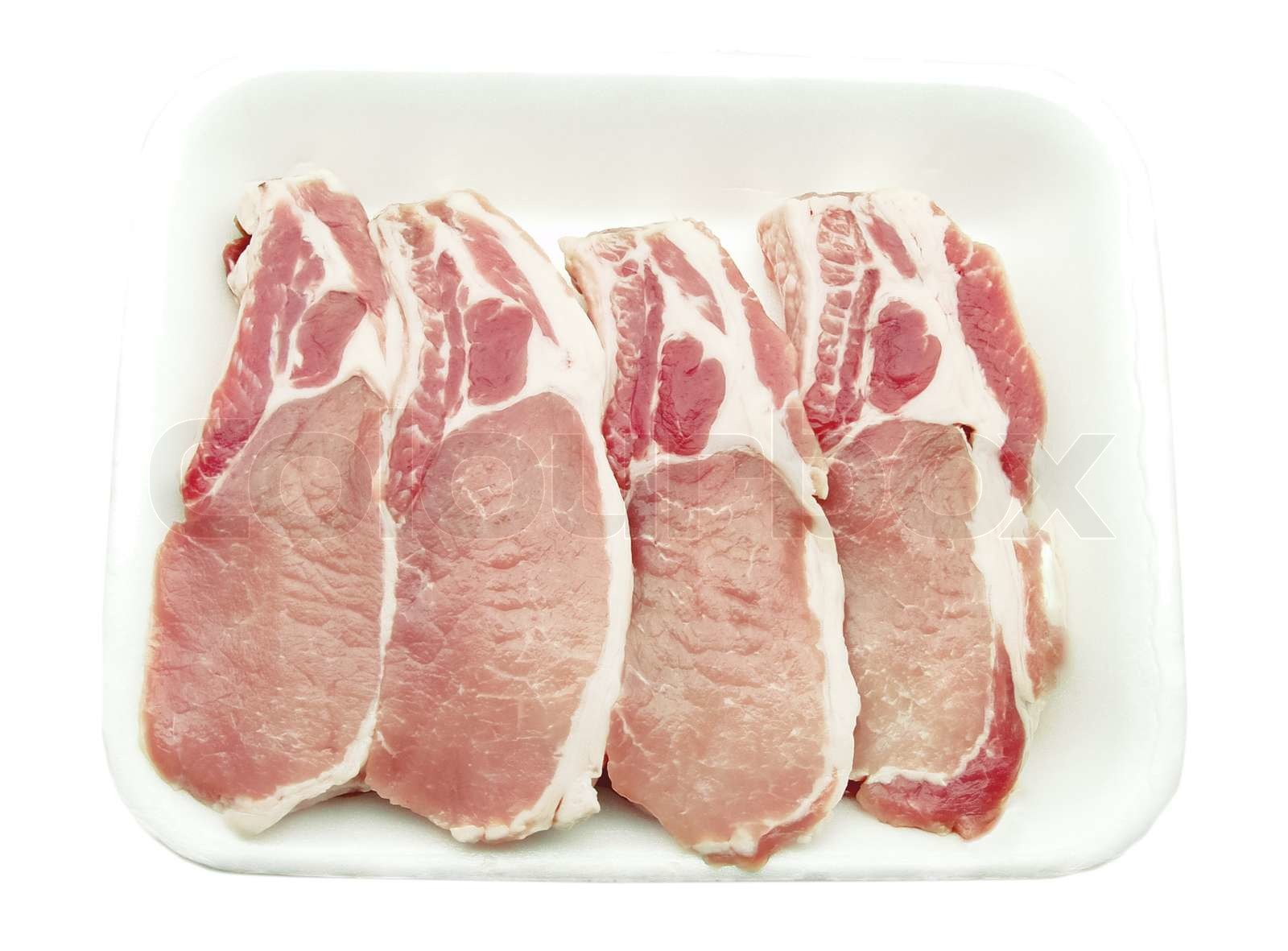 Pork chops packed in a container | Stock image | Colourbox