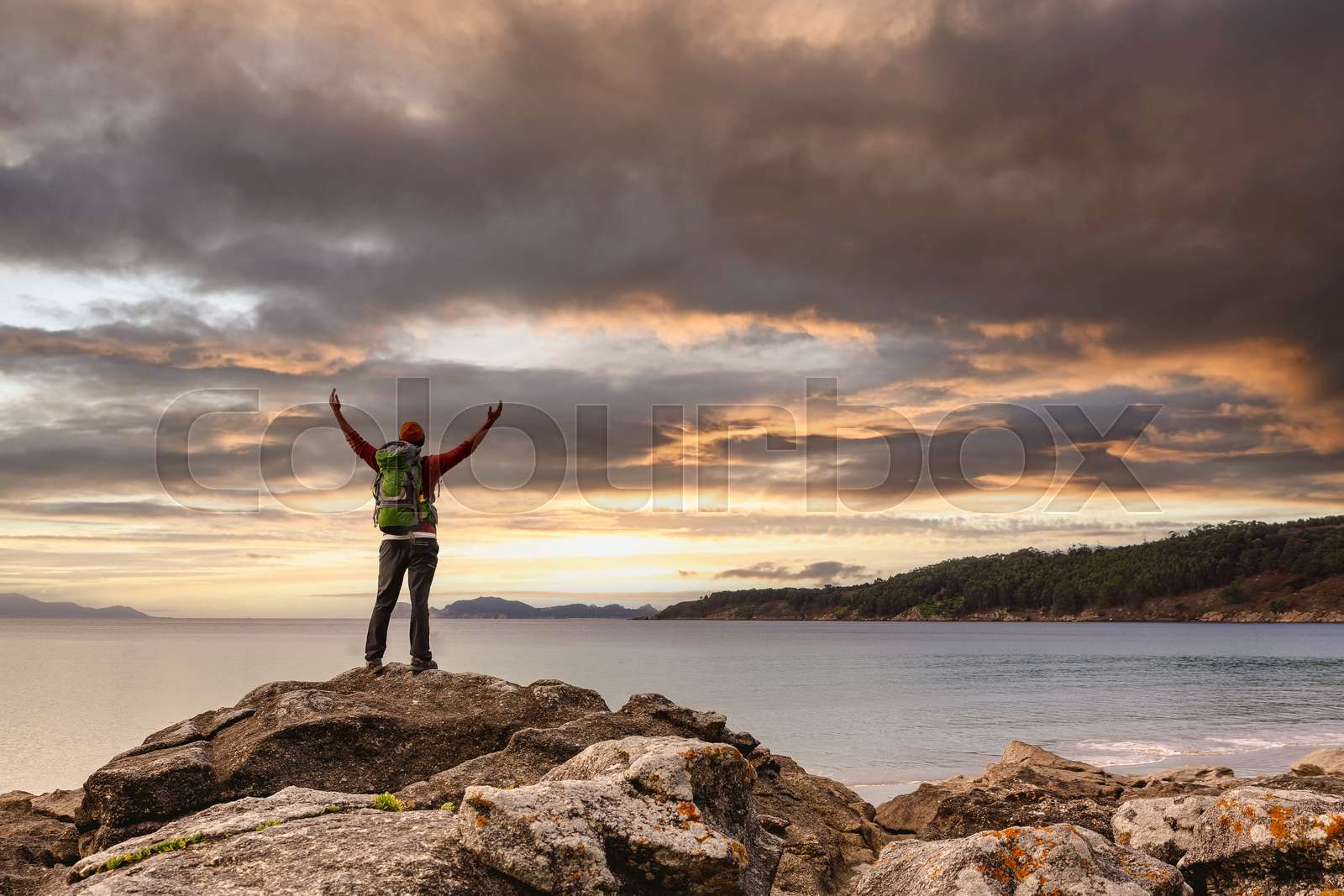 Man exploring the coast | Stock image | Colourbox