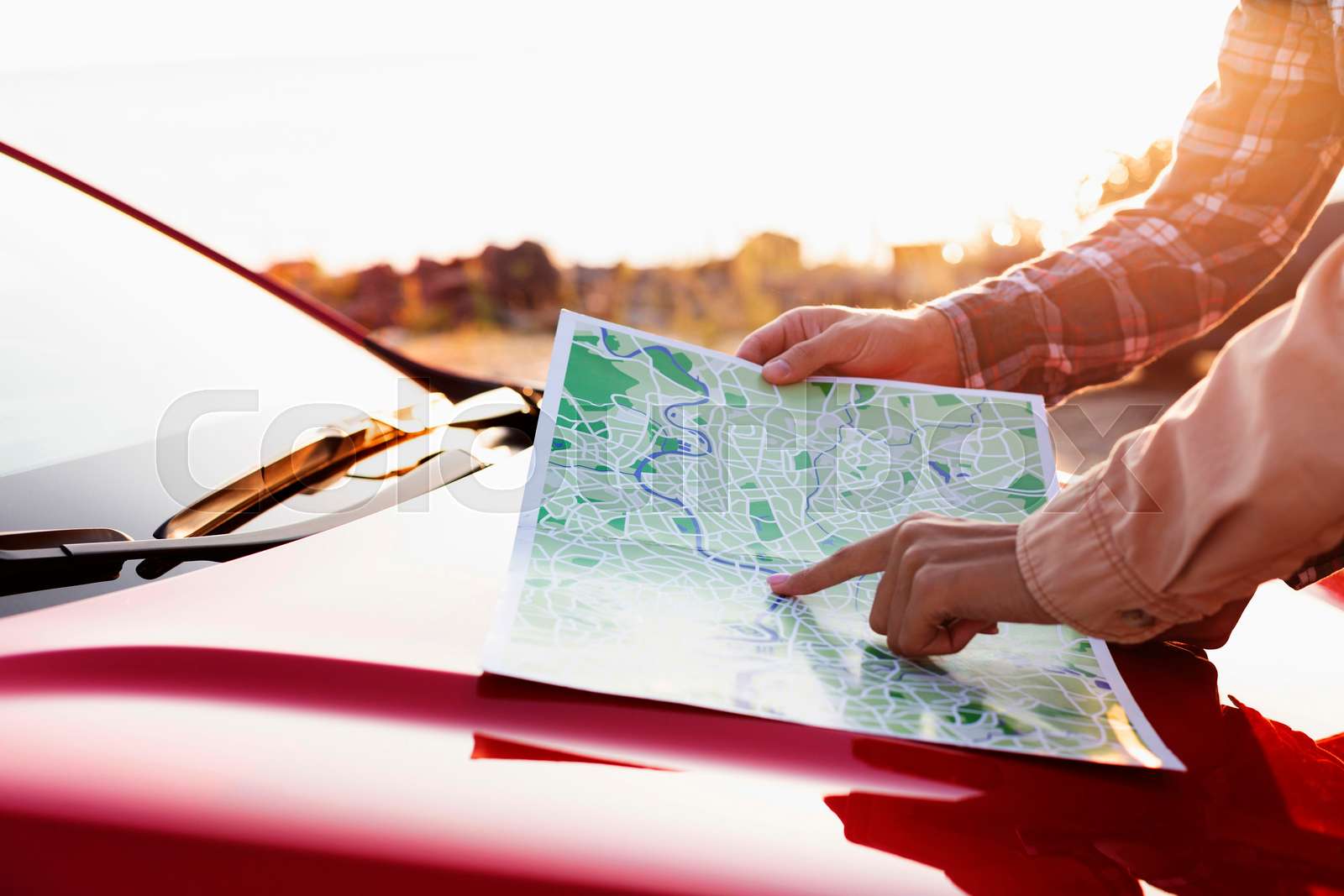 side view man woman checking map | Stock image | Colourbox