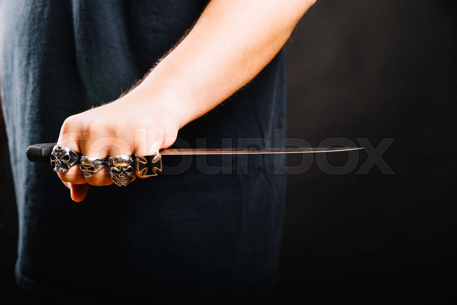 male hand with sharp dagger | Stock image | Colourbox
