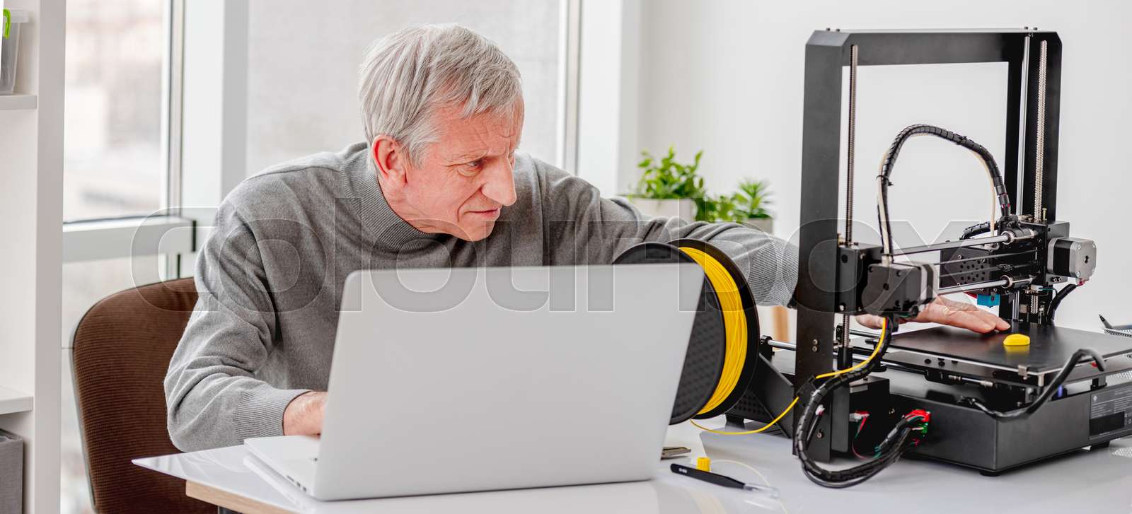 Man with 3D printer | Stock image | Colourbox