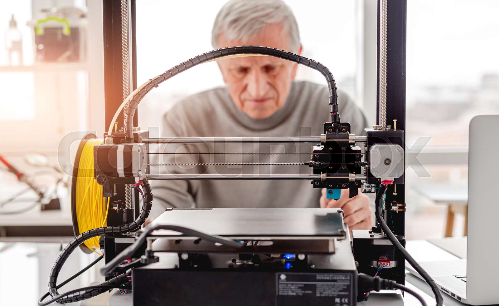 Man with 3D printer | Stock image | Colourbox