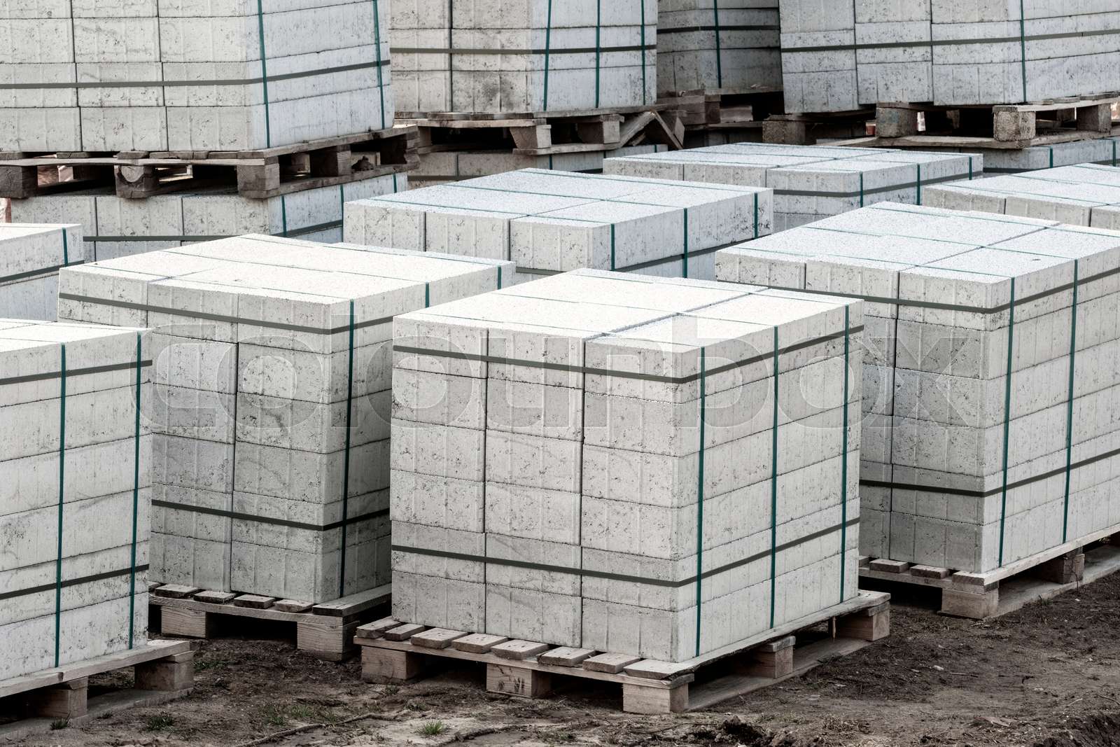 Concrete pavement tiles stacked on the wooden pallets | Stock image ...