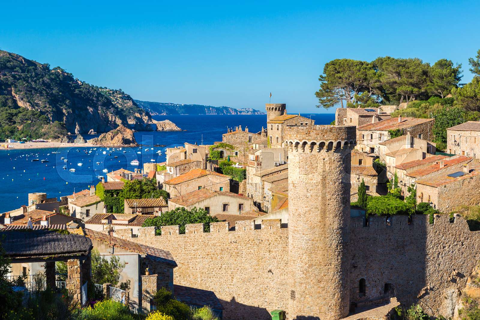 Beach at Tossa de Mar and fortress | Stock image | Colourbox