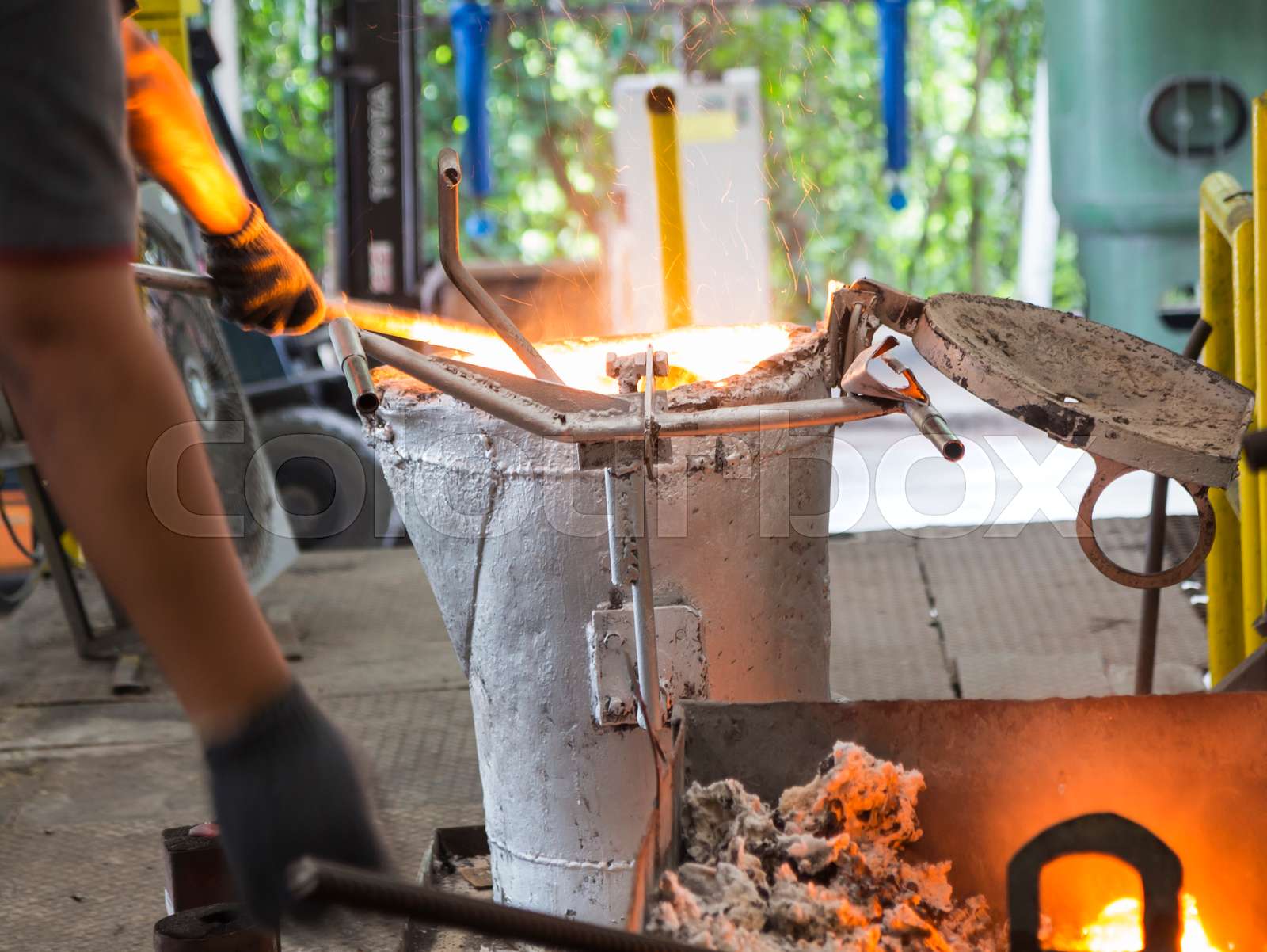 iron metal in laddle removing slag by operator | Stock image | Colourbox