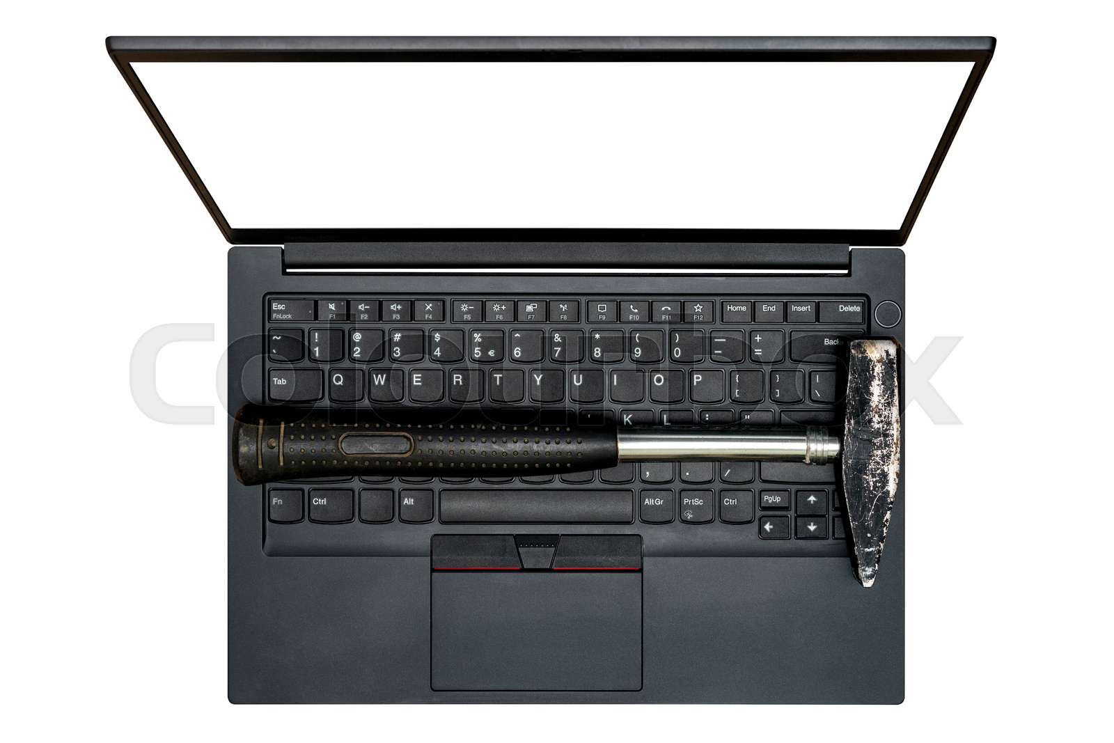 Hammer placed on laptop keyboard | Stock image | Colourbox