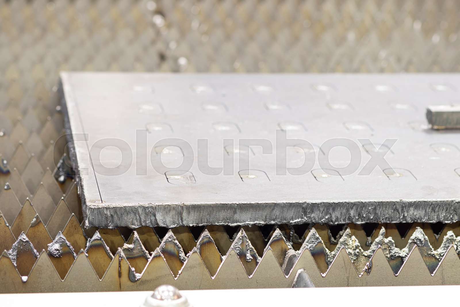 After laser cut steel plate on machine ; | Stock image | Colourbox