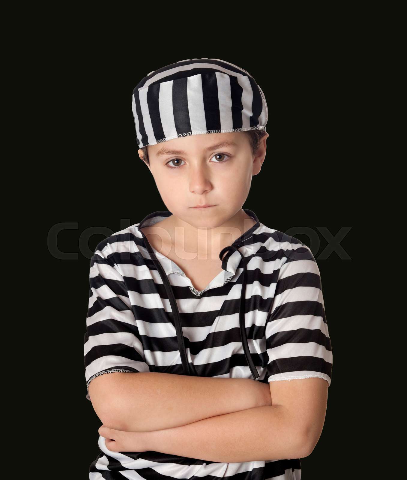 Sad prisoner wearing a striped uniform | Stock image | Colourbox