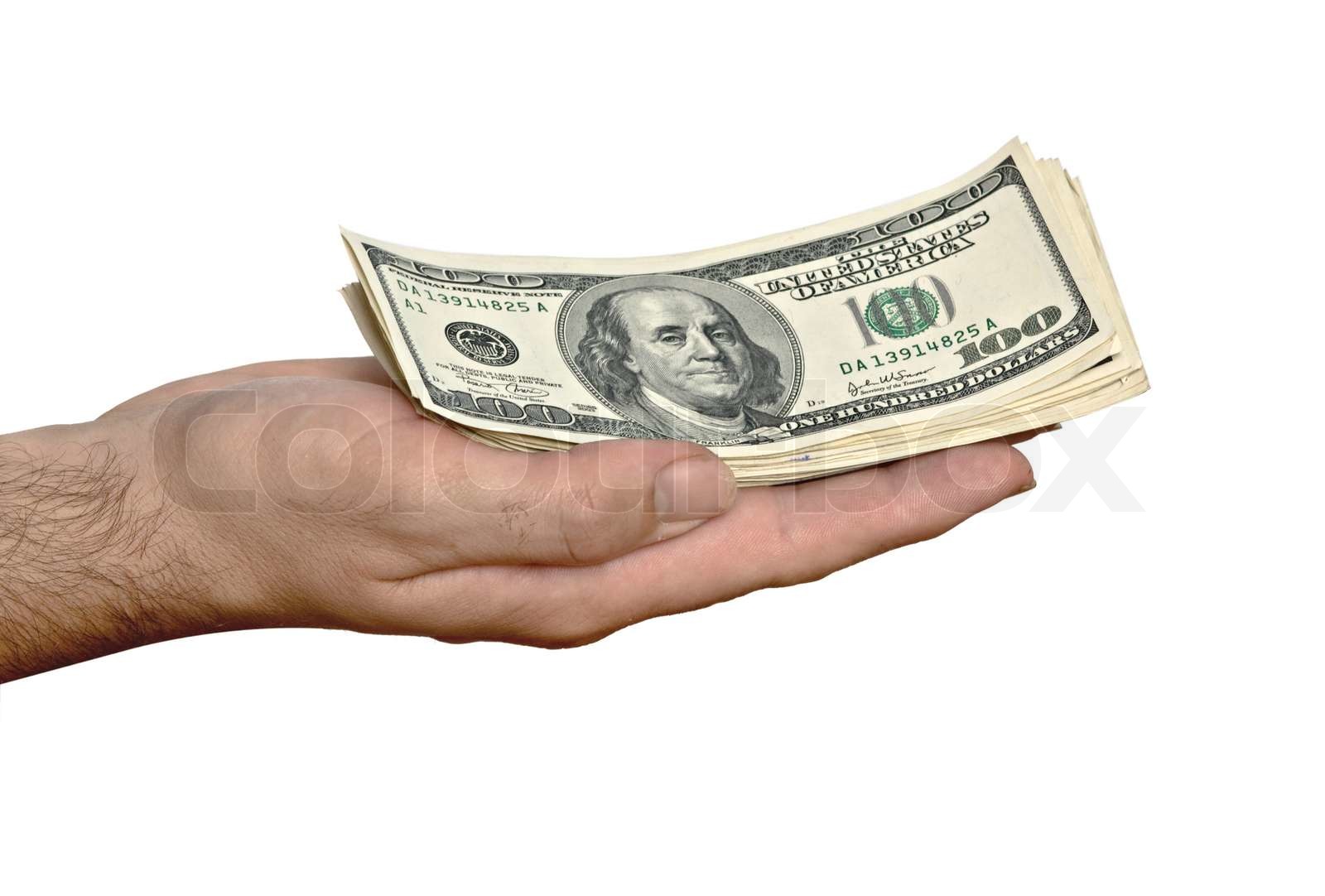 Dollars in hand | Stock image | Colourbox