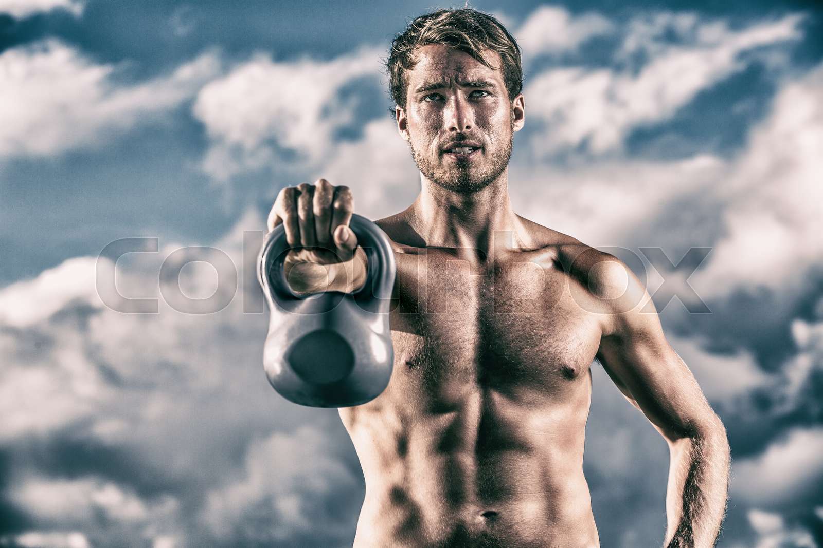 Fit man training lifting kettlebell weight bodybuilding with muscular ...