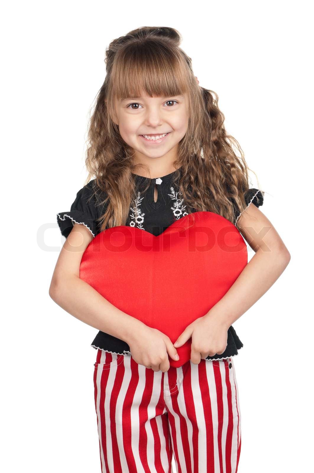 Little girl with red heart | Stock image | Colourbox