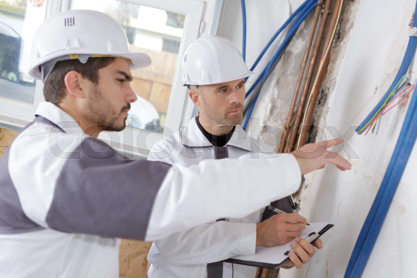 technician checking the state of water pipes indoors | Stock image ...