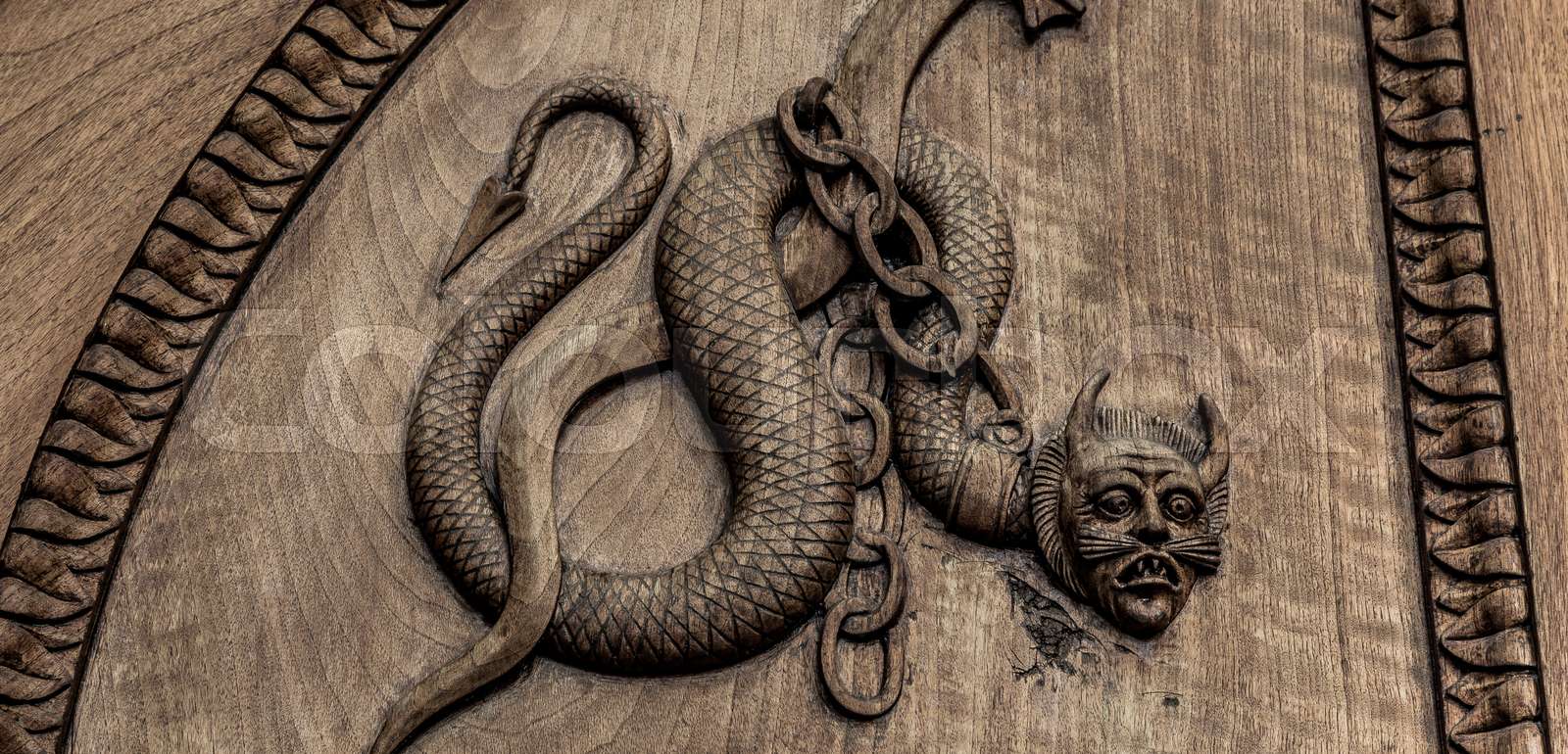 Devil snake symbol. Fantasy magic creature on an old door, 12th Century ...