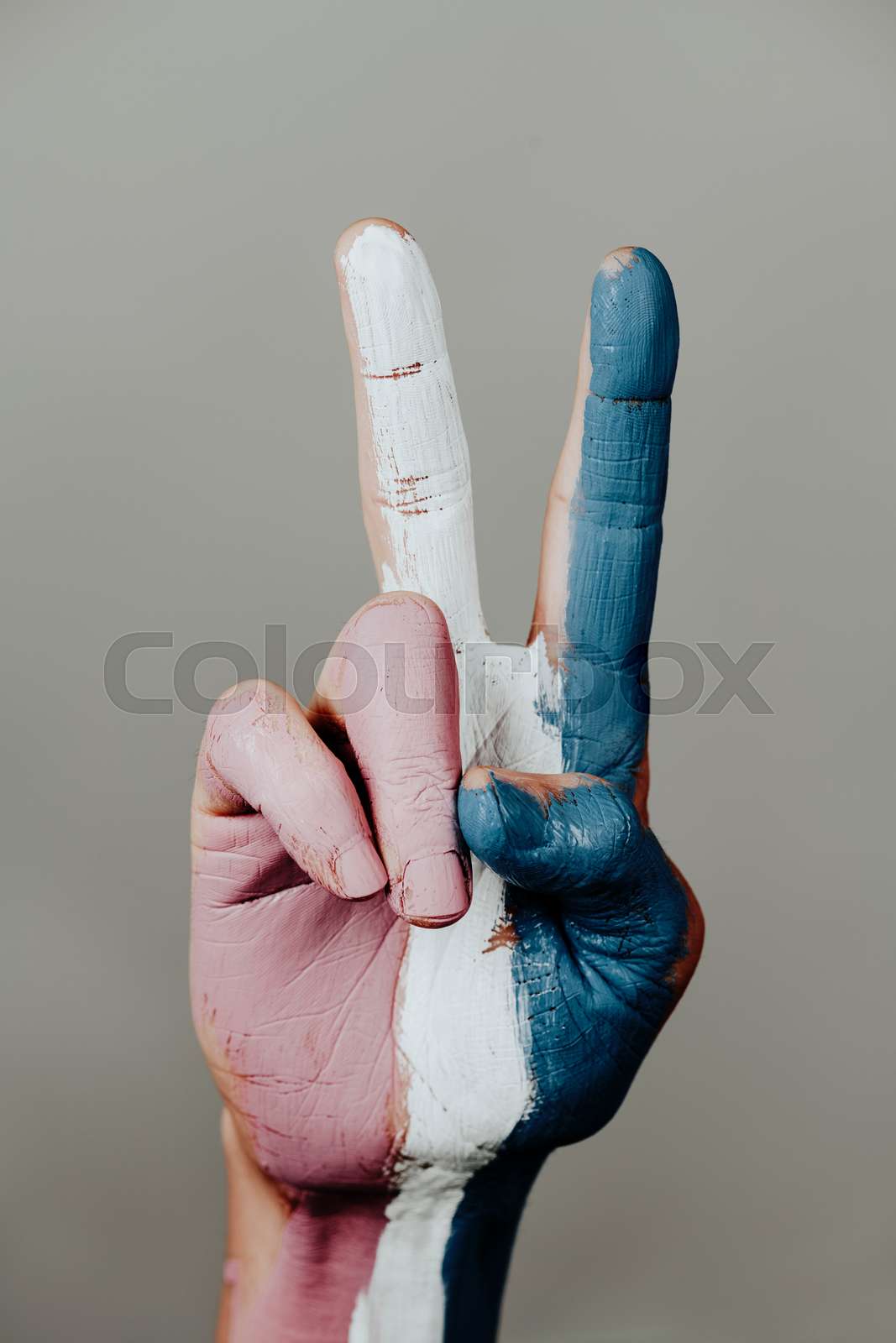 doing the V-sign with the transgender pride flag | Stock image | Colourbox