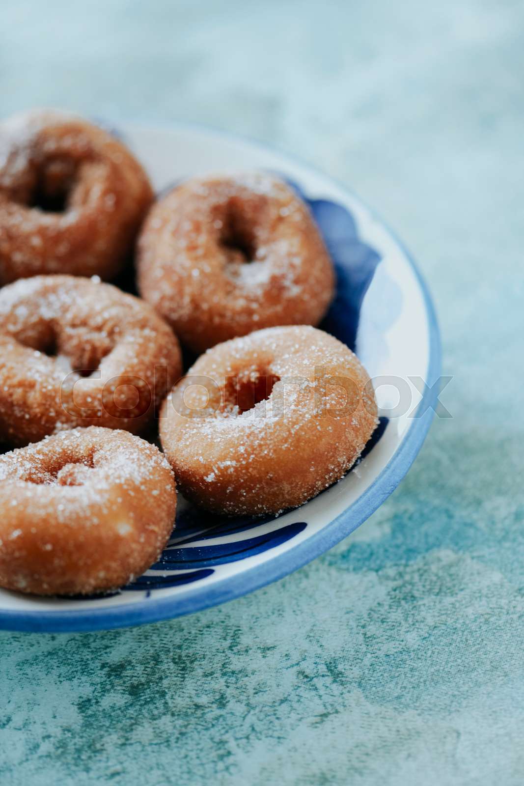 spanish donuts sprinkled with sugar in a bowl | Stock image | Colourbox