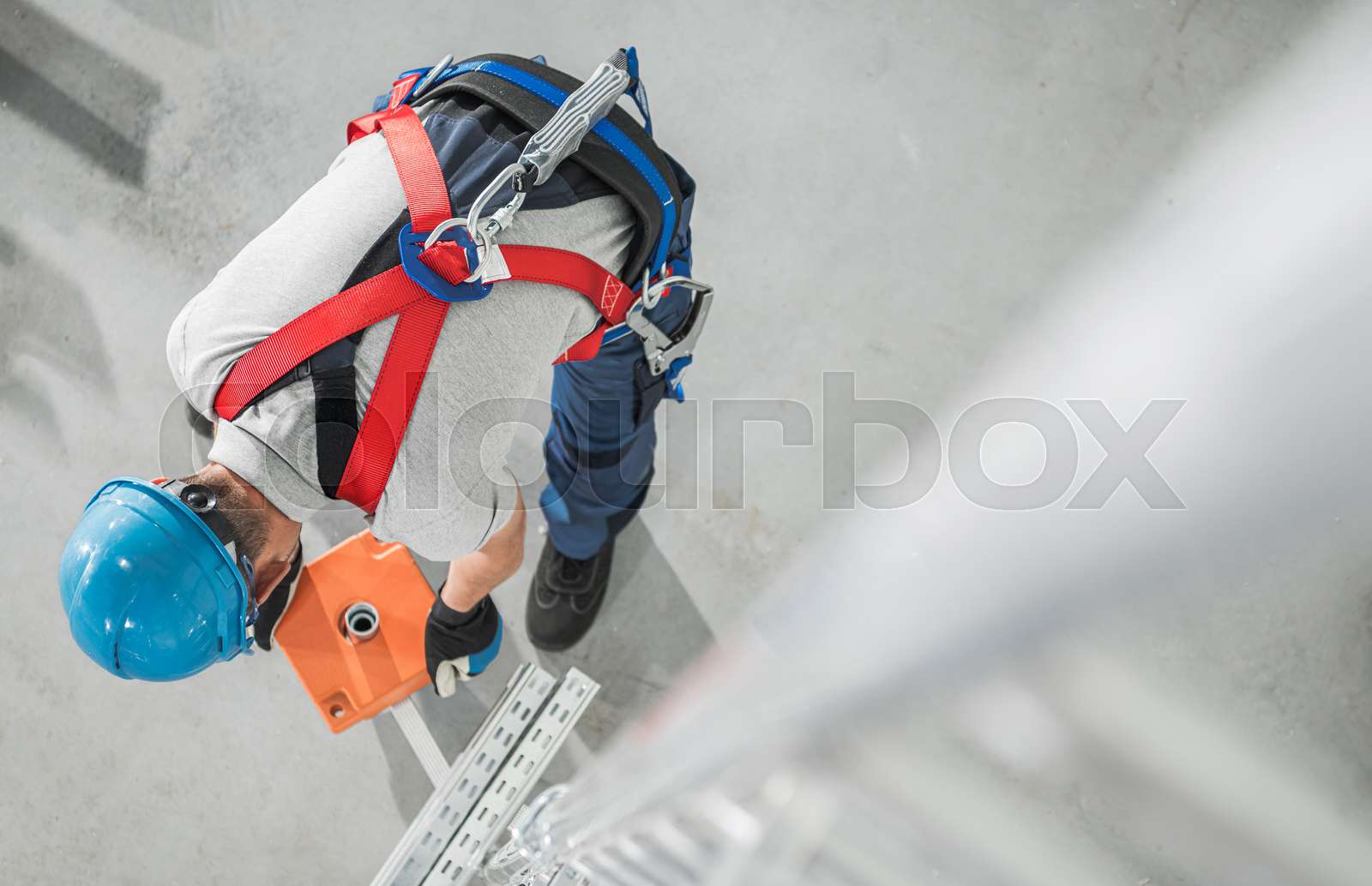 Scaffolding Counterweight Installing by a Worker | Stock image | Colourbox