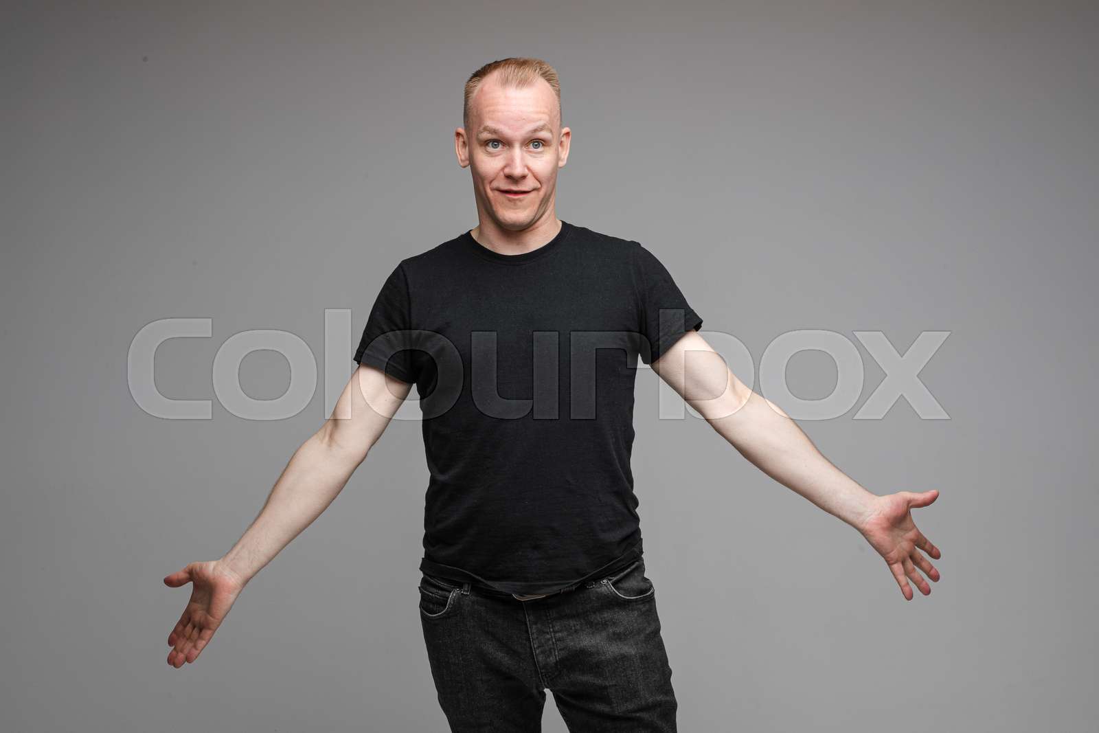 Confused Caucasian man with outstretched arms. | Stock image | Colourbox