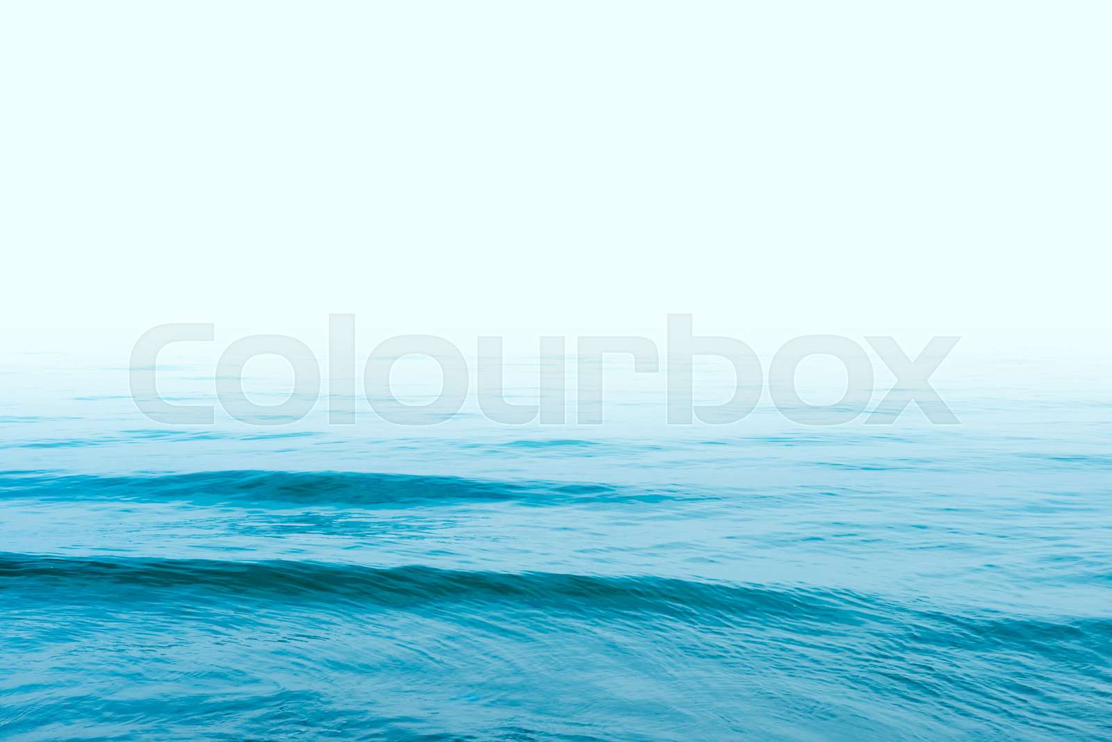 Blue sea water with white sky | Stock image | Colourbox