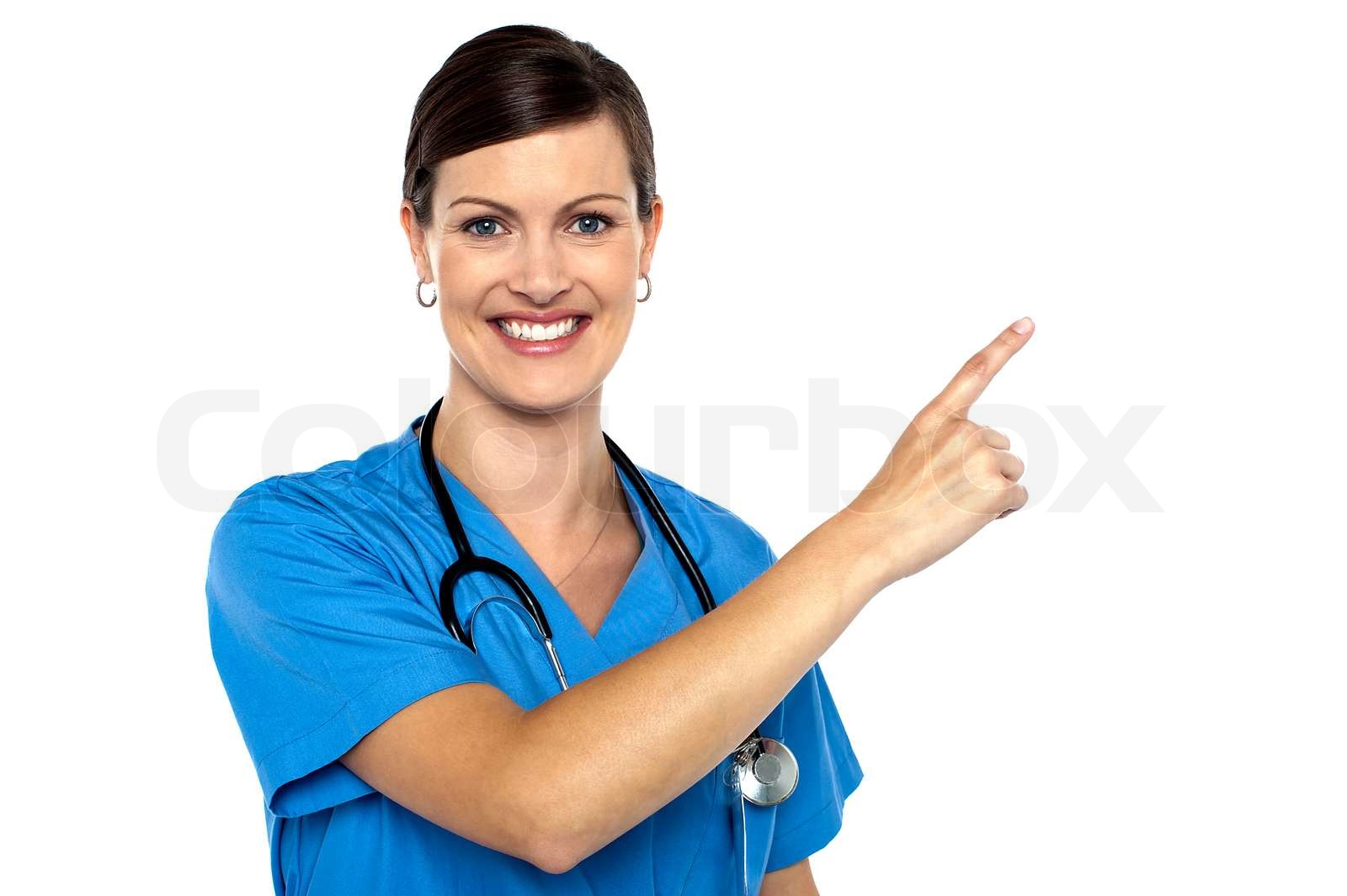 Doctor pointing away with her index finger | Stock image | Colourbox