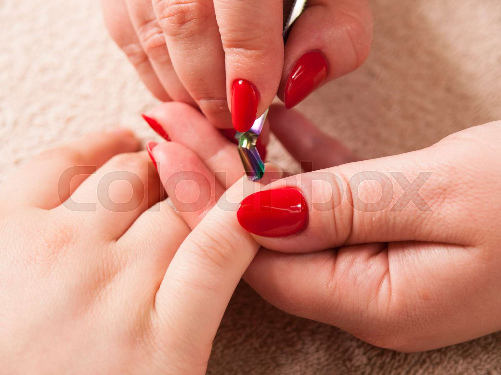 Preparing nail and hands for polishing. Hand wellnes in manicure salon ...