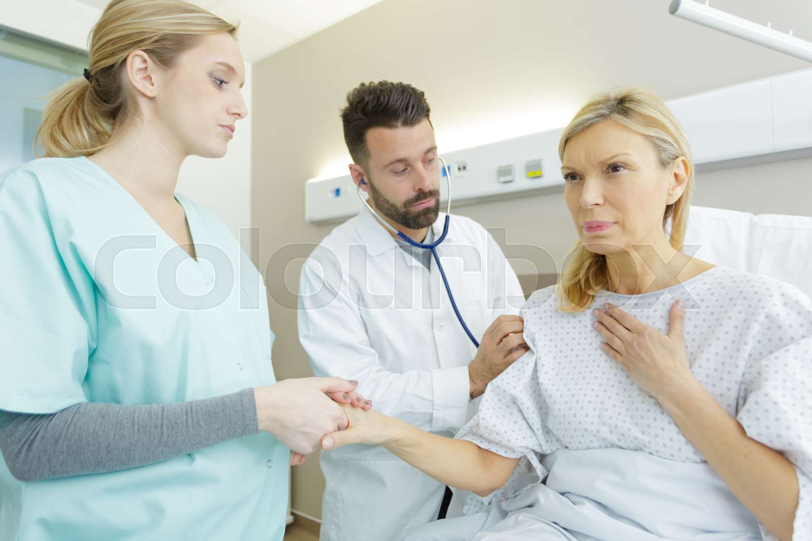 doctor and nurse visiting senior patient woman at hospital ward | Stock ...