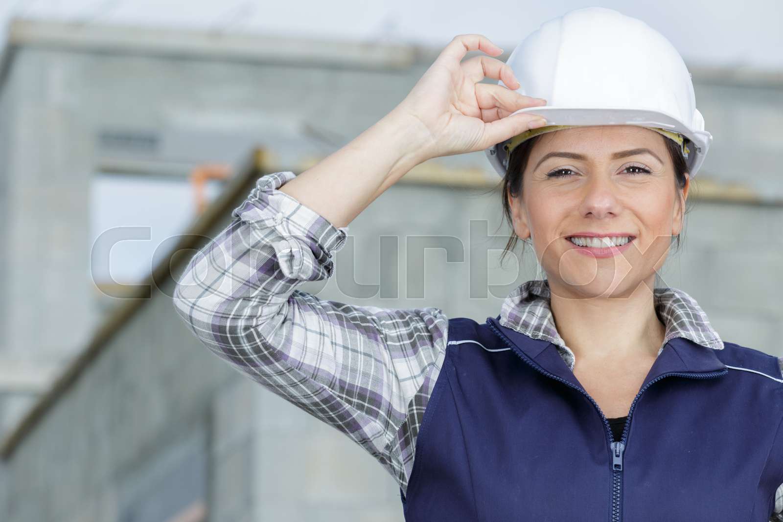 a young smiling builder woman | Stock image | Colourbox