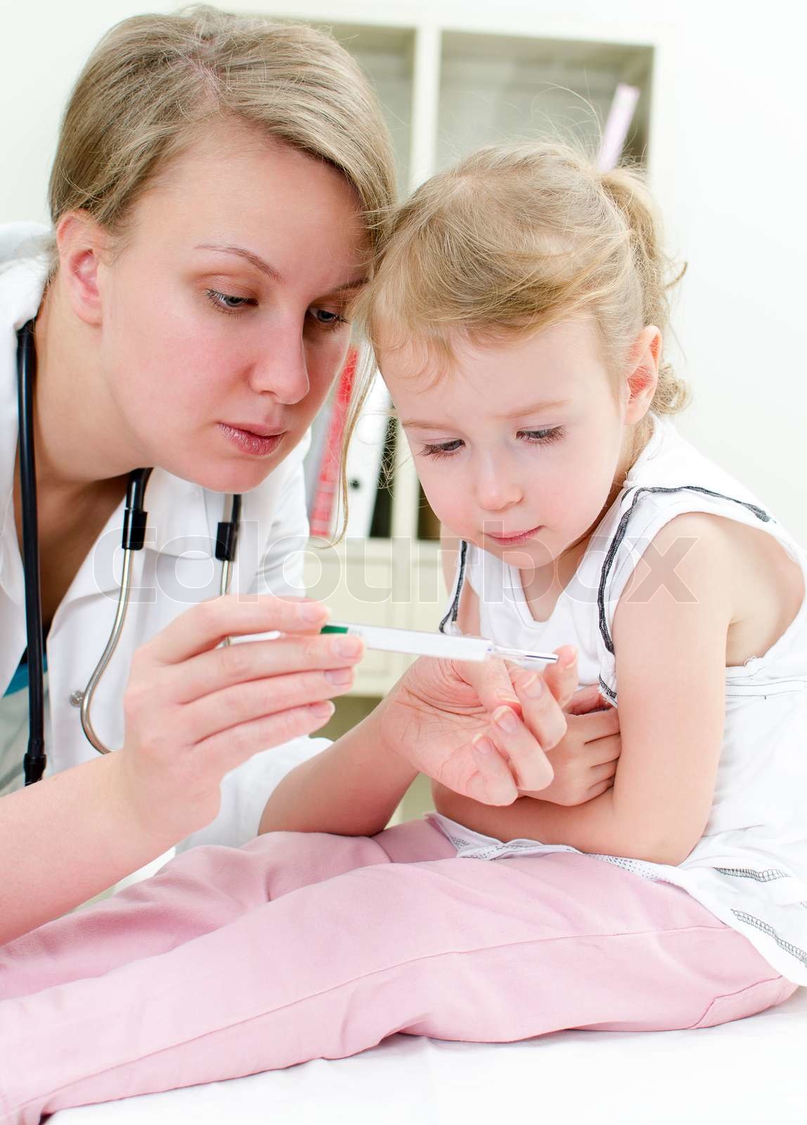 Cute little girl visiting pediatrician | Stock image | Colourbox