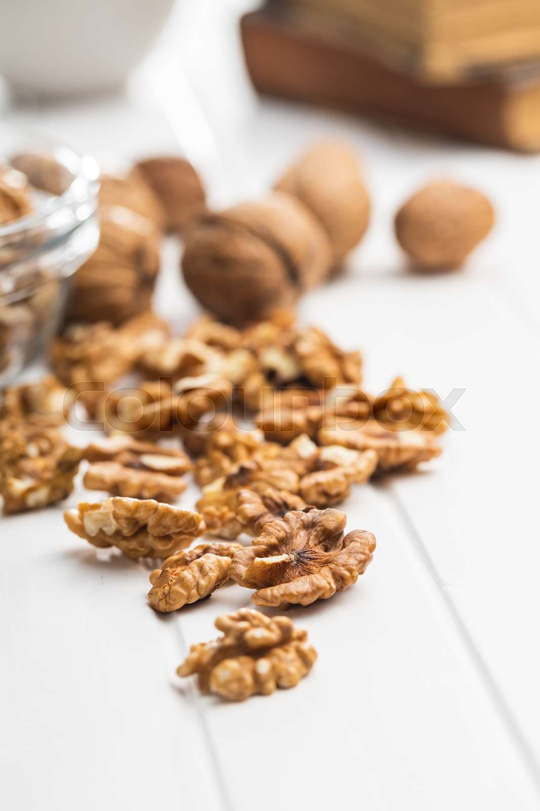 Peeled walnut kernels on white table. | Stock image | Colourbox