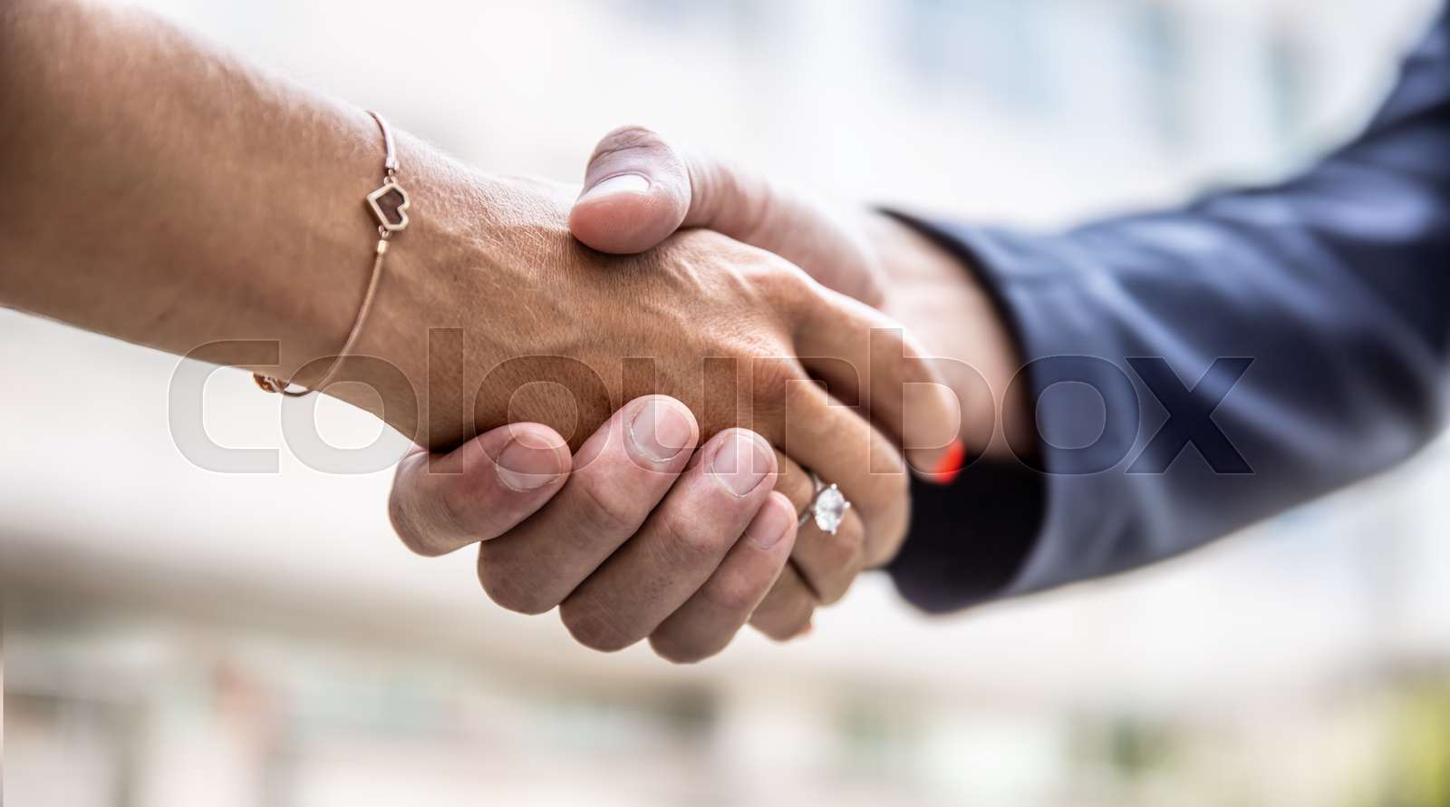 Detail of a professional handshake of a male and female hand | Stock ...