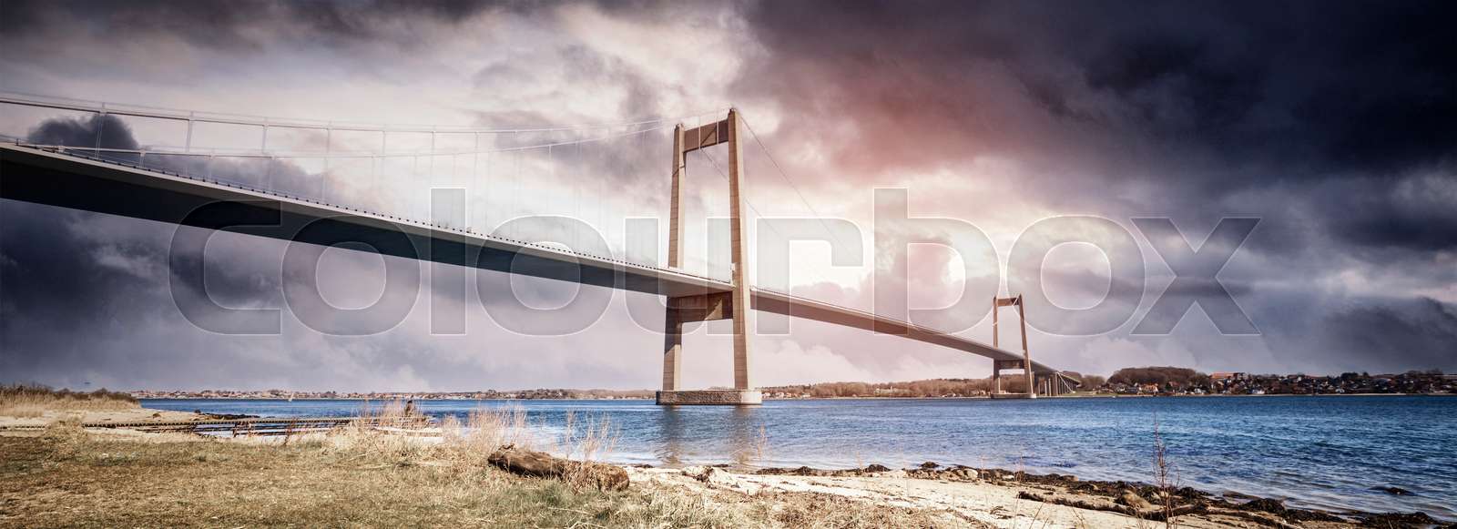 Bridge over water in a dramatic panorama scenery | Stock image | Colourbox