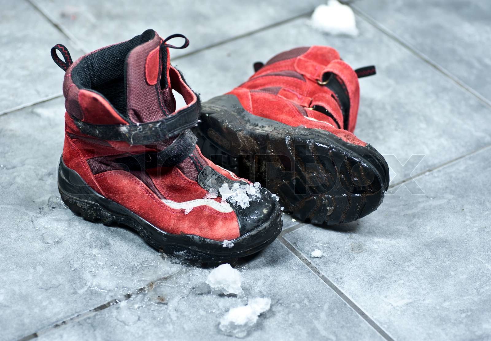 Winter shoes making a mess in the entrance | Stock image | Colourbox