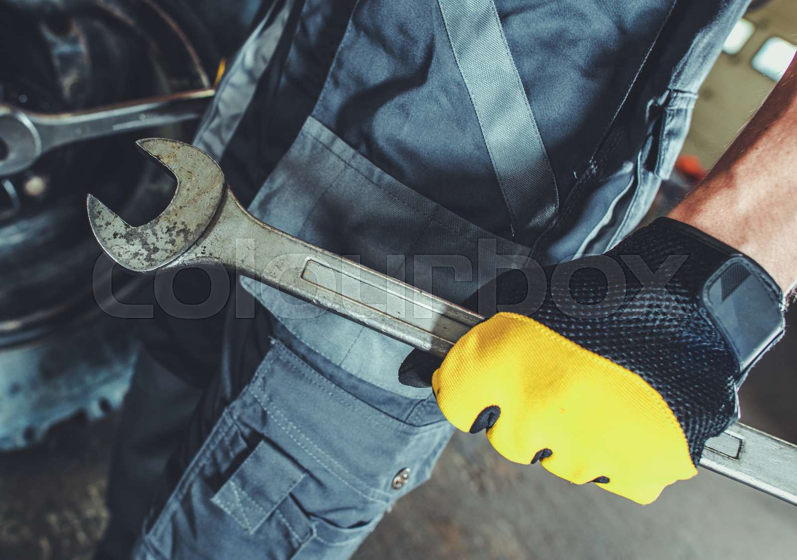 Professional Mechanic with Iron Wrench in His Hand | Stock image ...